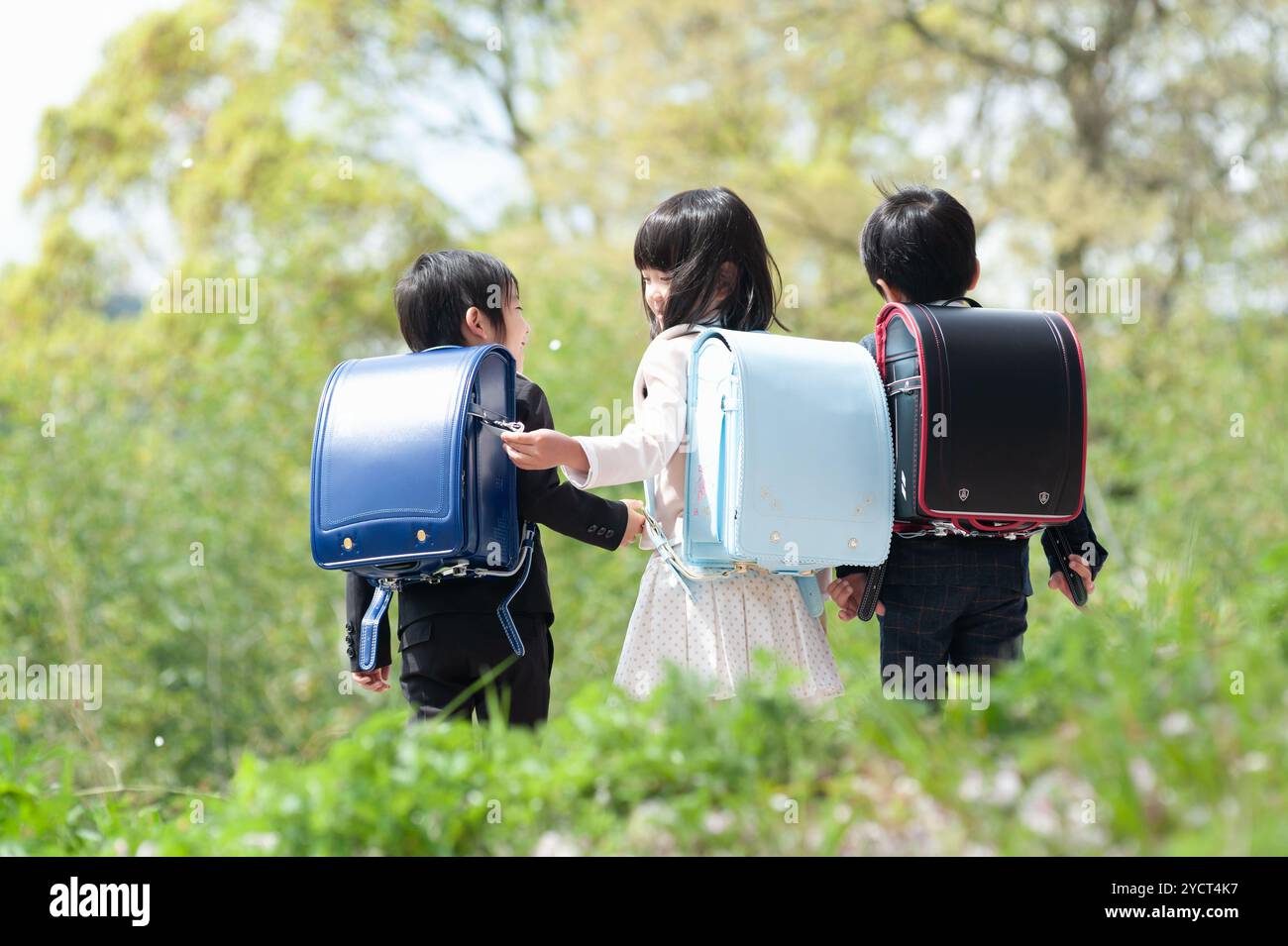 Three new first-year students walking side by side Stock Photo - Alamy