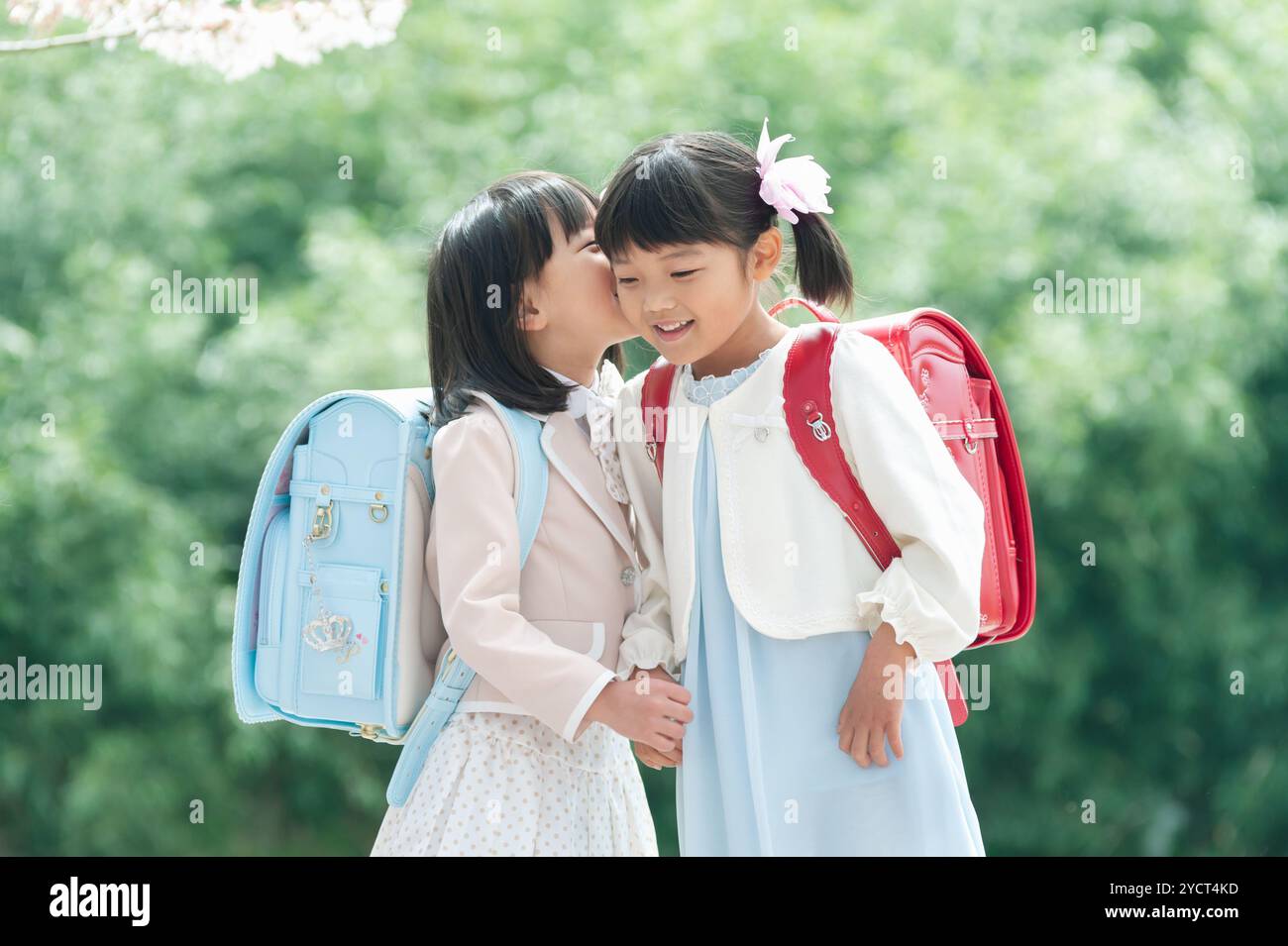Two new first-year students in formal dress giving a private talk Stock ...