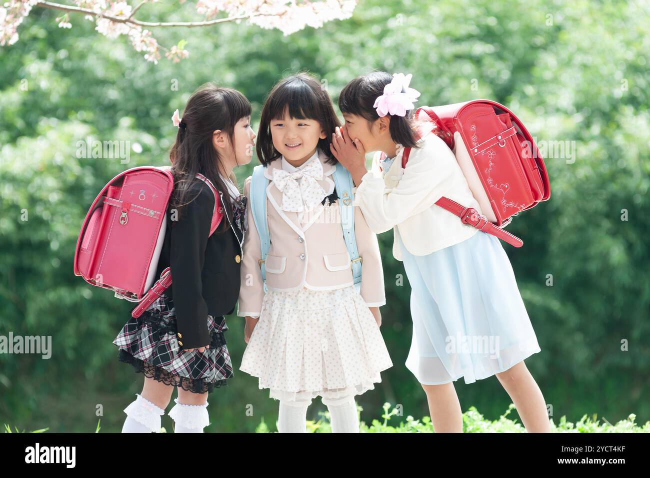 Three new first-year students in formal dress talking in private Stock ...
