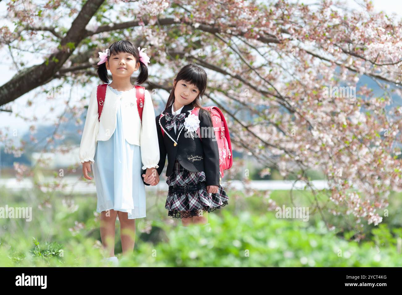 Two new first-year students standing side by side in formal dress Stock ...