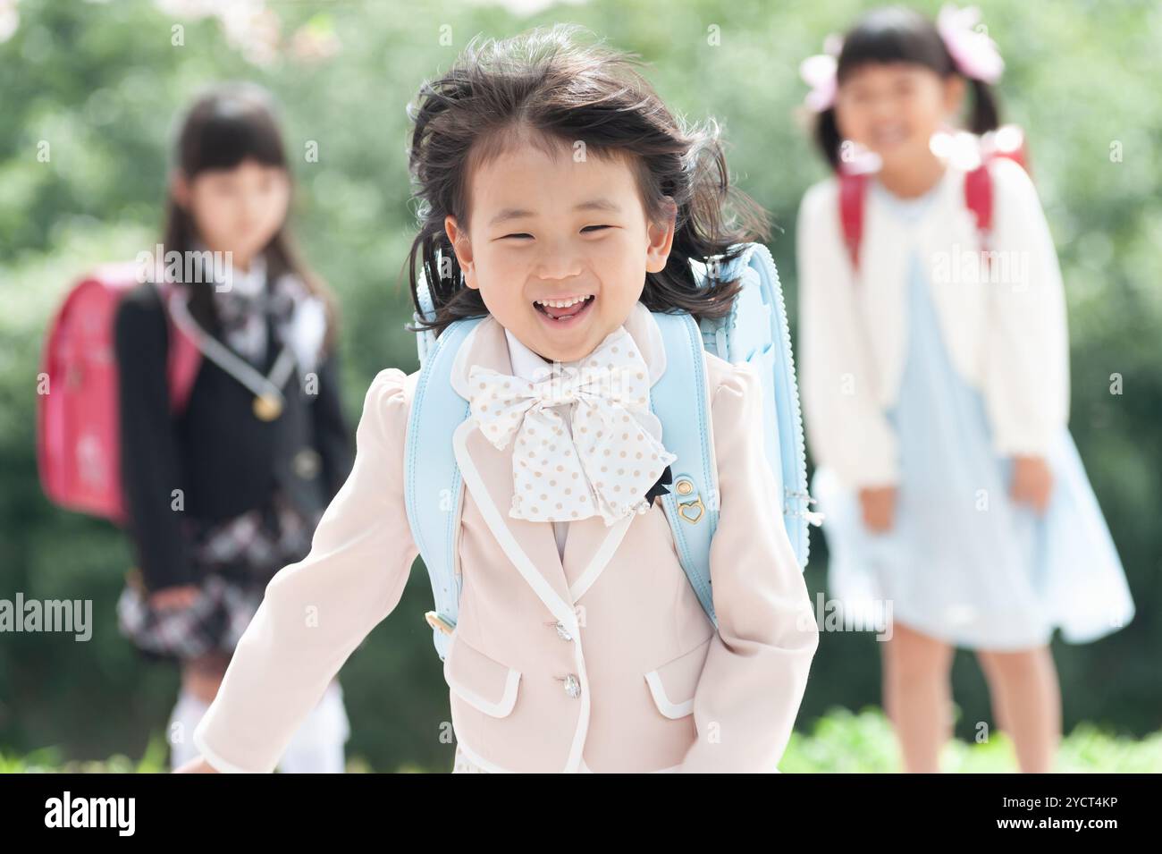 New first-year students in formal wear running towards you laughing ...