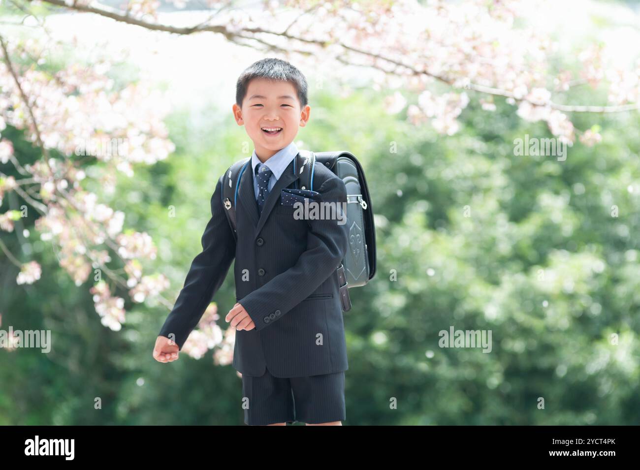 New first-year boy smiling in formal dress Stock Photo - Alamy