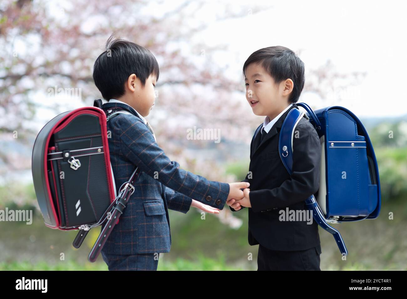 New first-year boy smiling in formal dress Stock Photo - Alamy