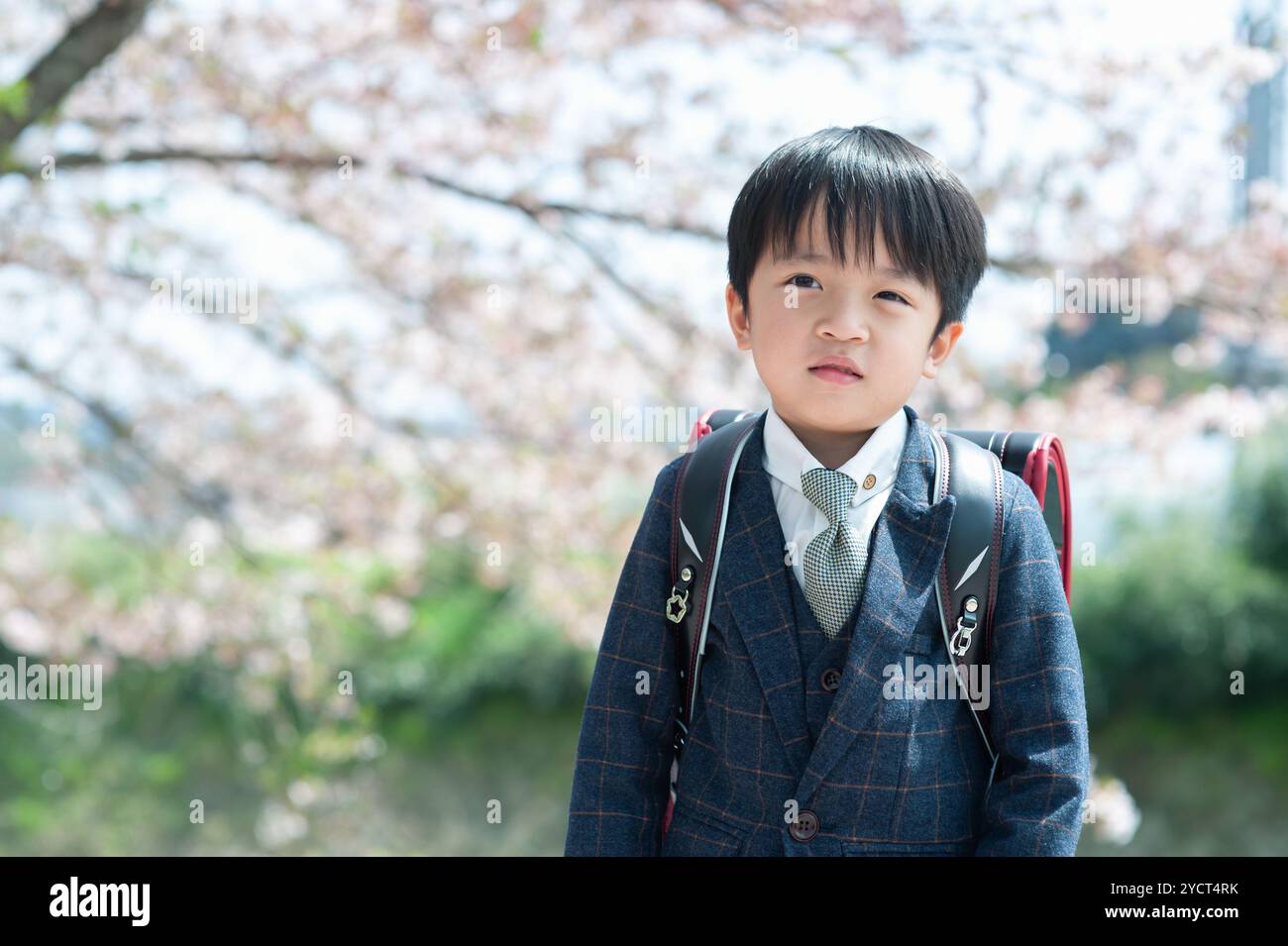 New first-year boy smiling in formal dress Stock Photo - Alamy