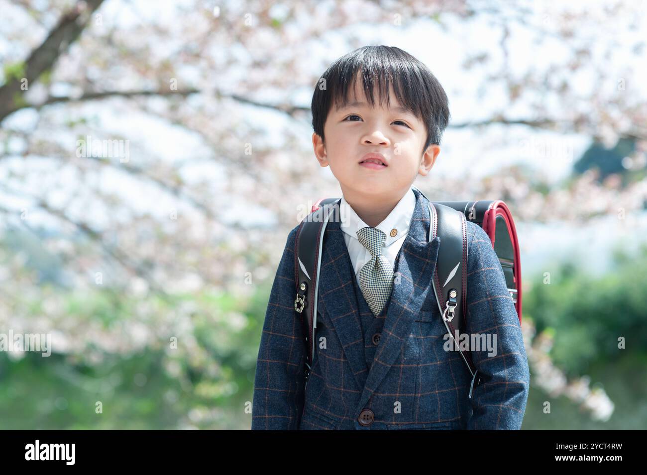 New first-year boy smiling in formal dress Stock Photo - Alamy