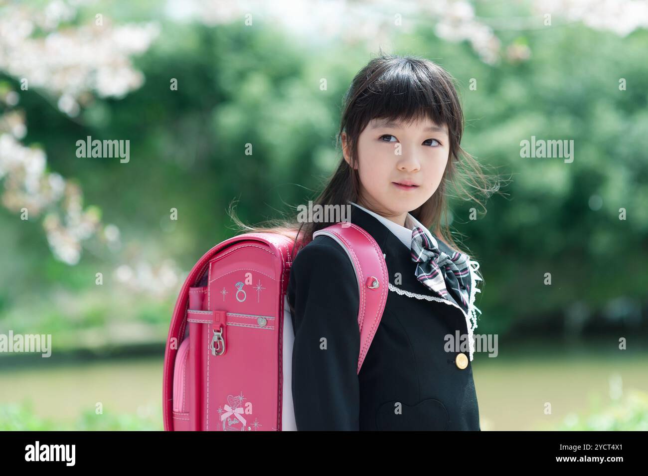 New first year girl smiling in formal dress Stock Photo - Alamy