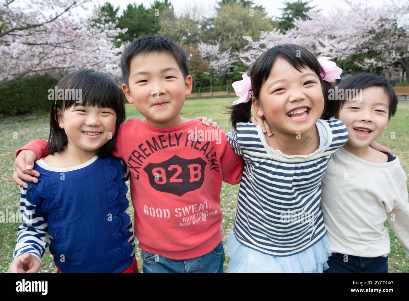 Four children squaring their shoulders Stock Photo - Alamy