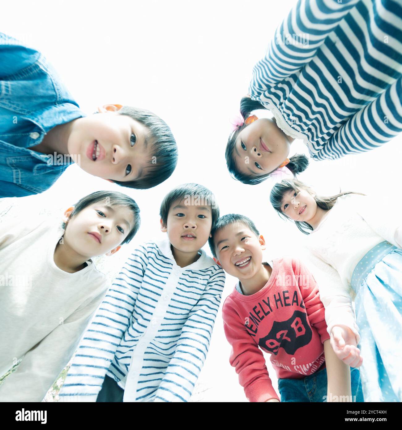 Seven children in a circle Stock Photo - Alamy