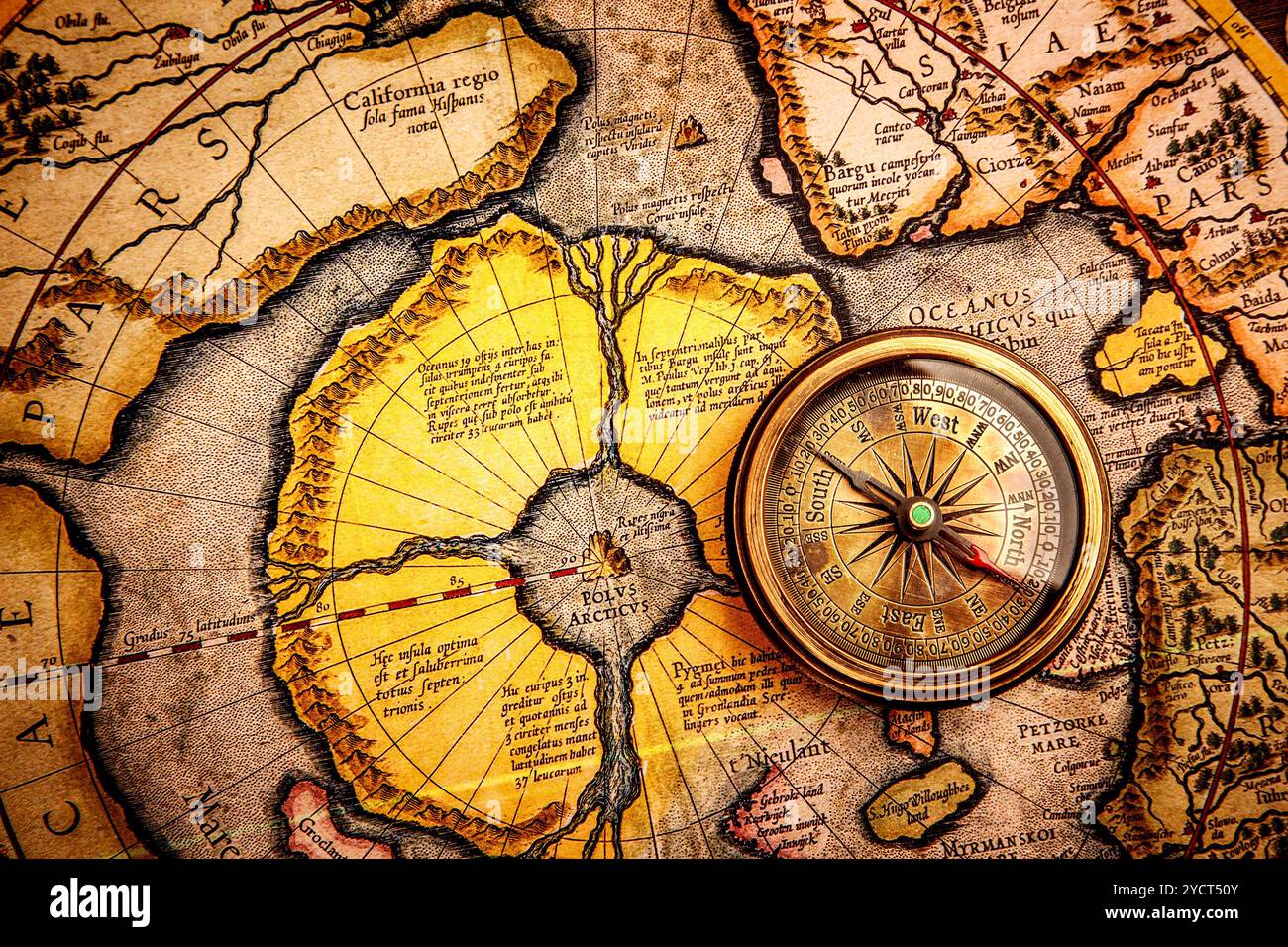Vintage compass lies on the ancient map of the North Pole (also ...