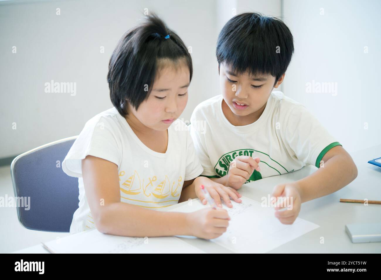 Primary schools students grading a test Stock Photo - Alamy