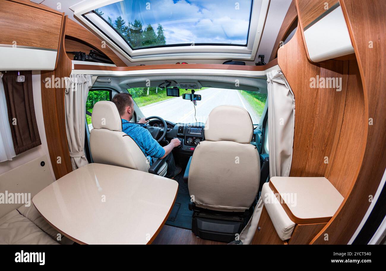 Man driving on a road in the Camper Van Stock Photo - Alamy