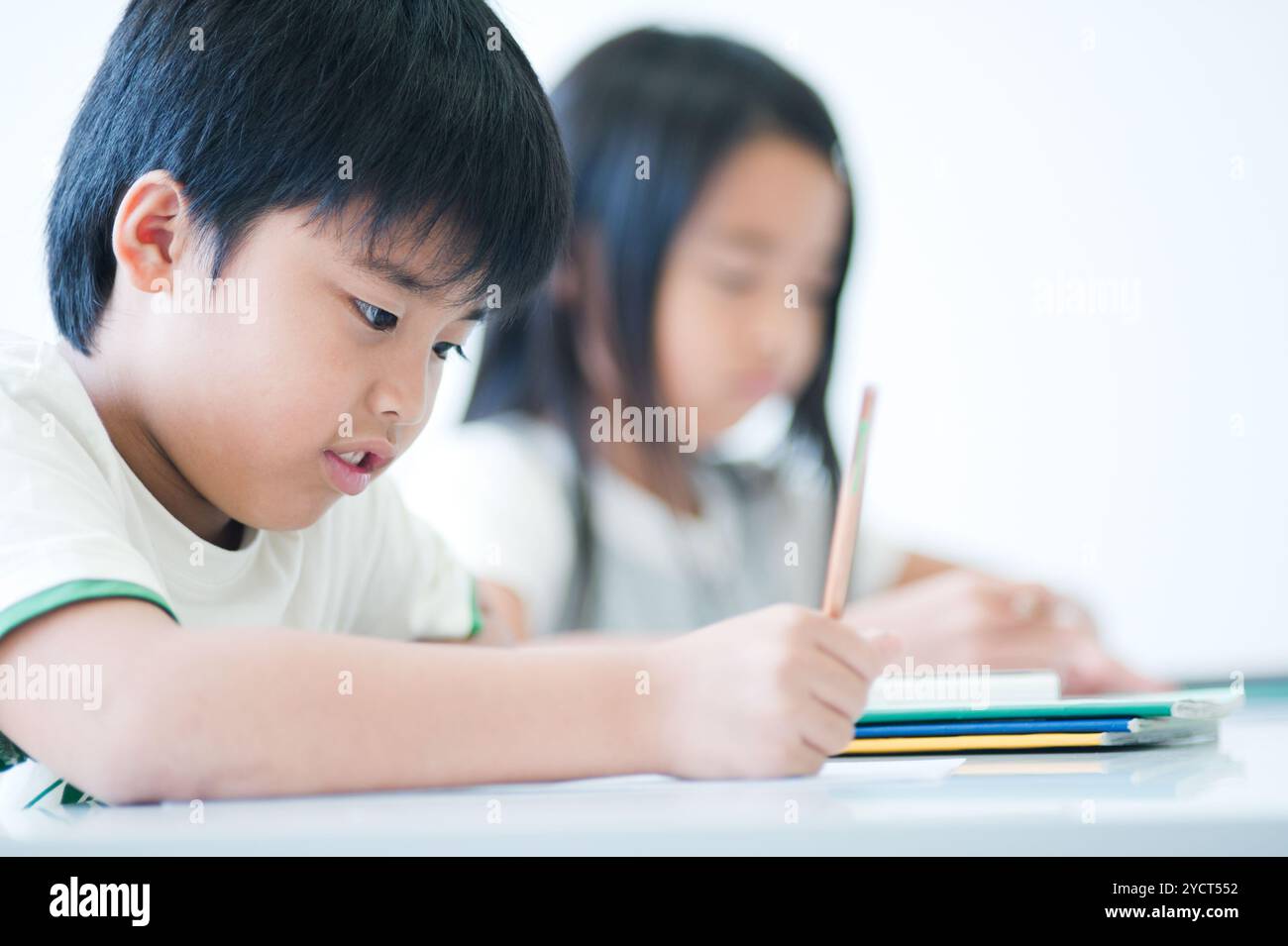 Primary schools student studying Stock Photo - Alamy