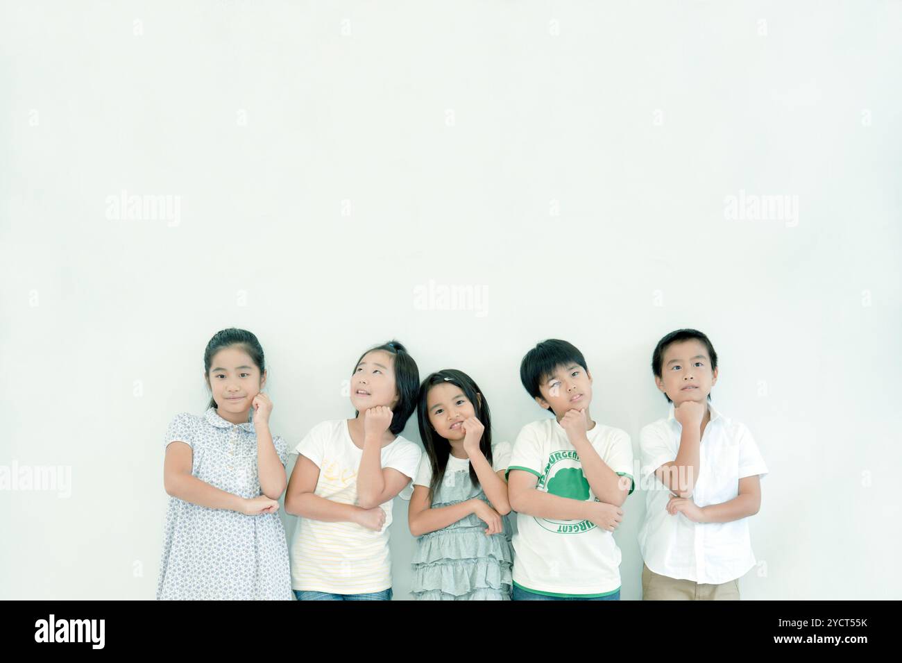 Five school children in thinking pose Stock Photo - Alamy