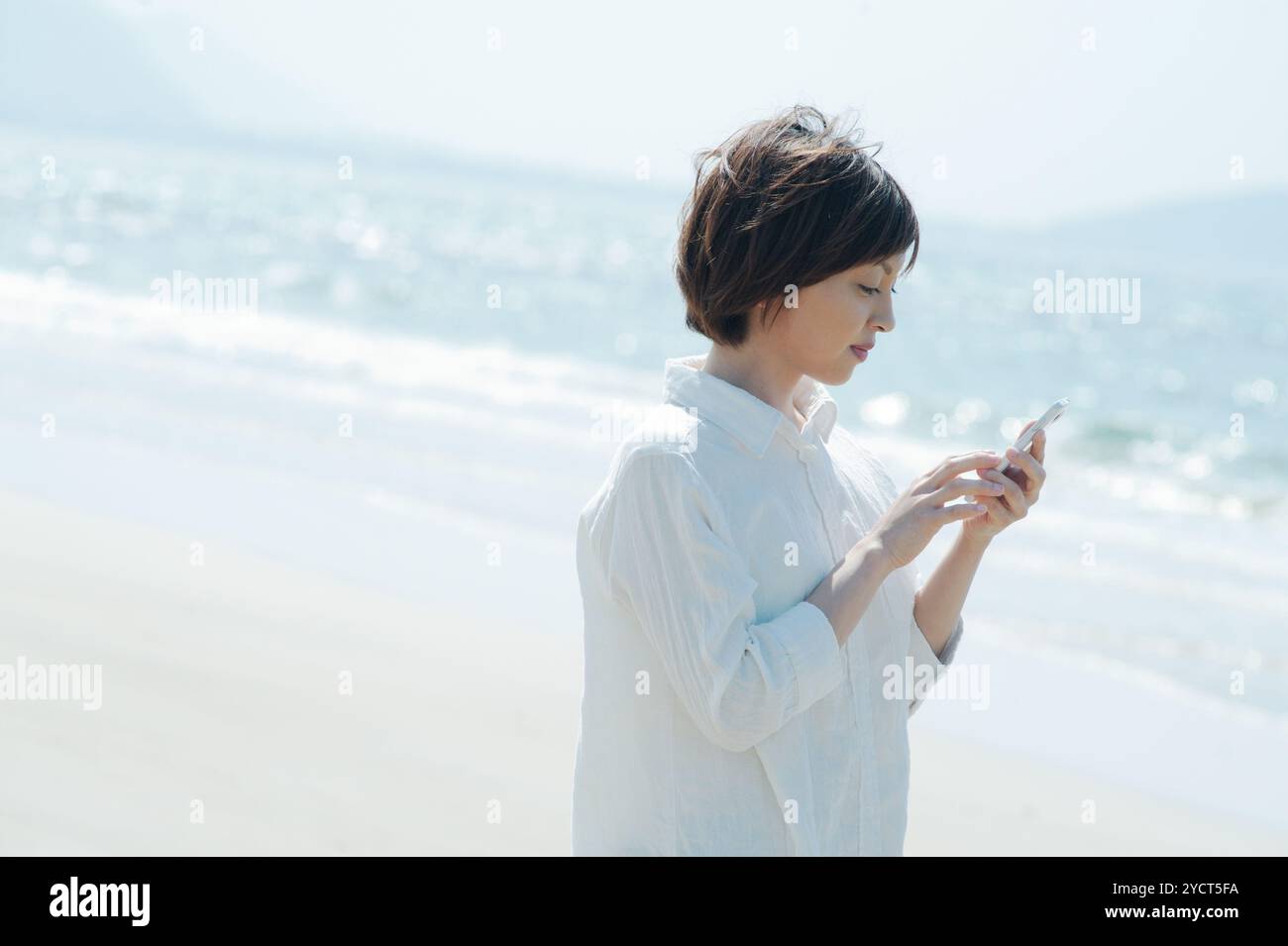 Woman staring phone screen hi-res stock photography and images - Alamy