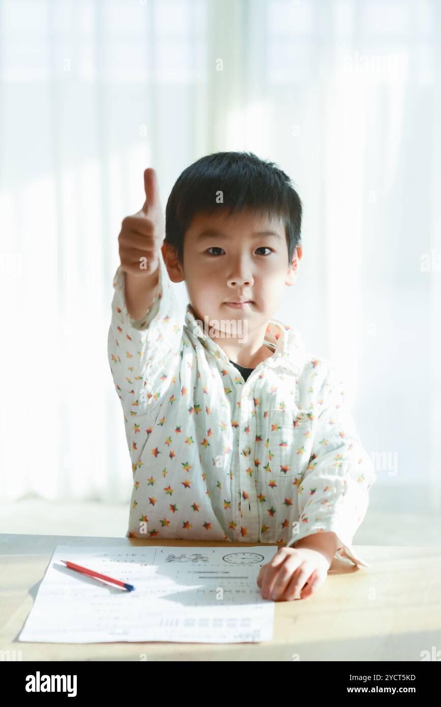 A primary school boy happy after finishing his studies Stock Photo - Alamy