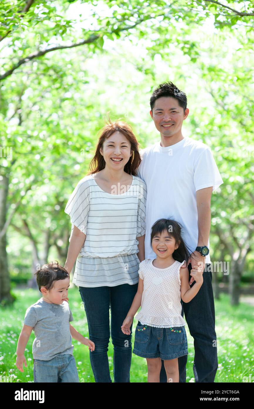 Happy Japanese family in fresh green Stock Photo - Alamy