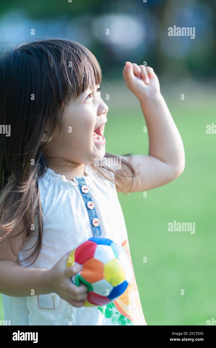 Girls playing ball Stock Photo - Alamy