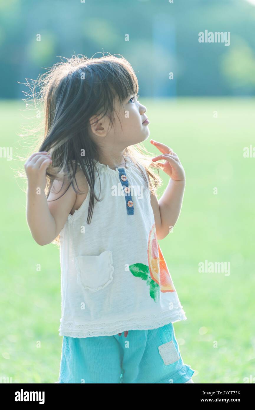 Girl looking up in profile Stock Photo - Alamy