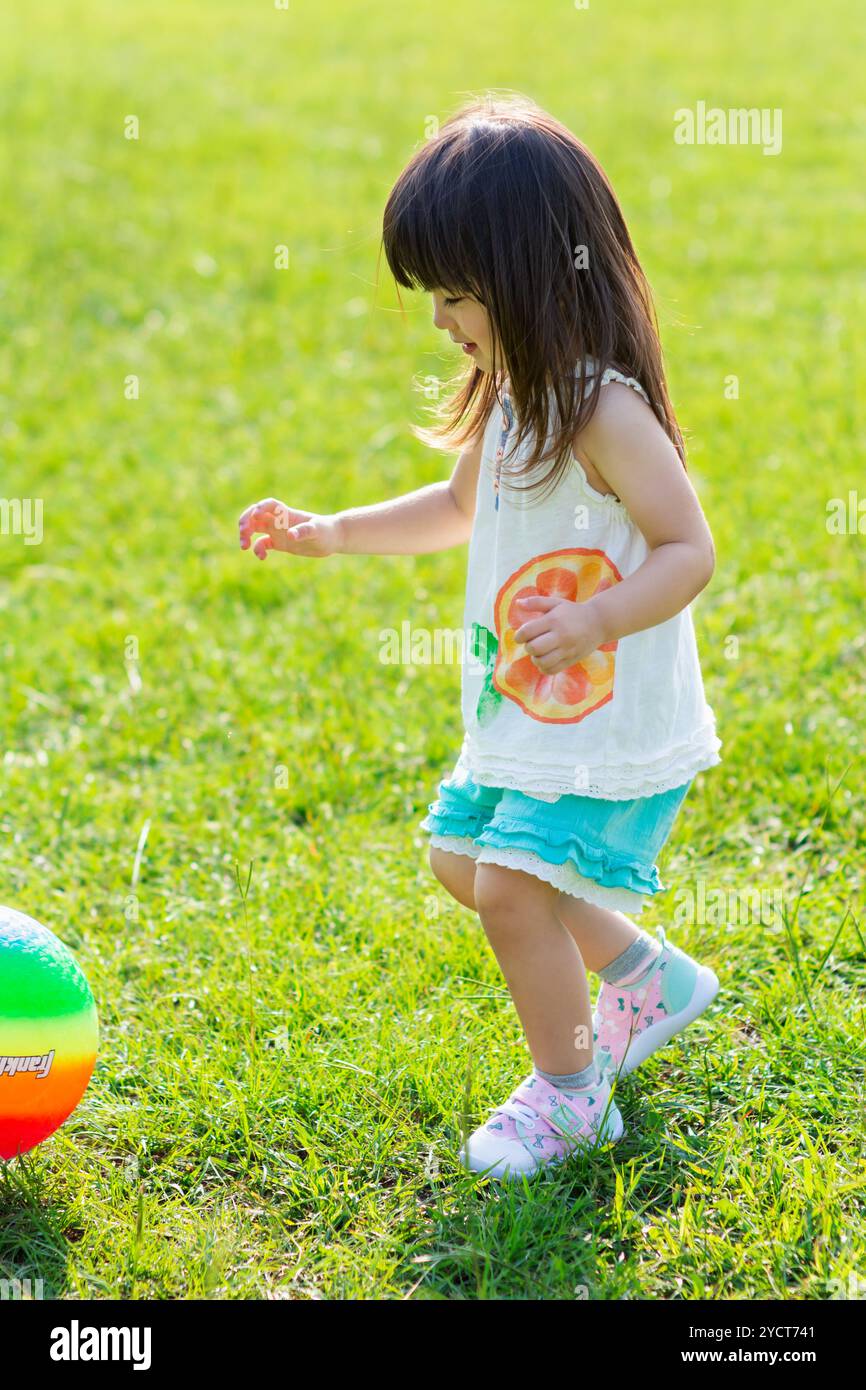 Girls playing ball Stock Photo - Alamy
