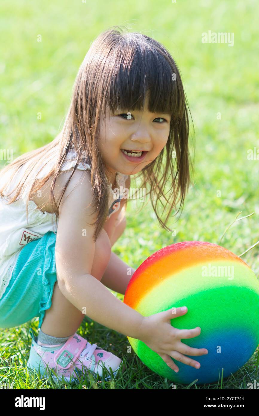 Girls playing ball Stock Photo - Alamy