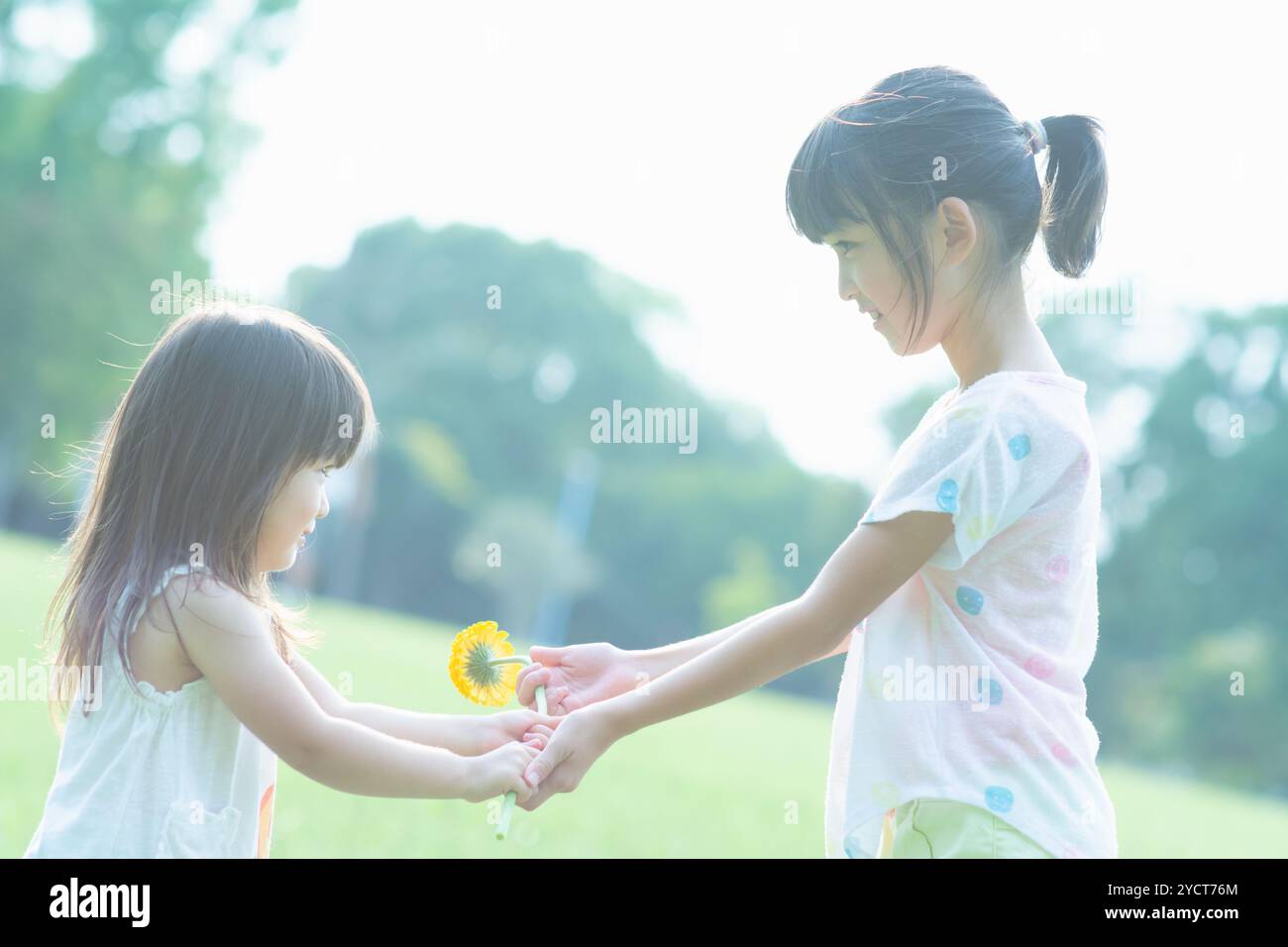 Handing happy hi-res stock photography and images - Alamy