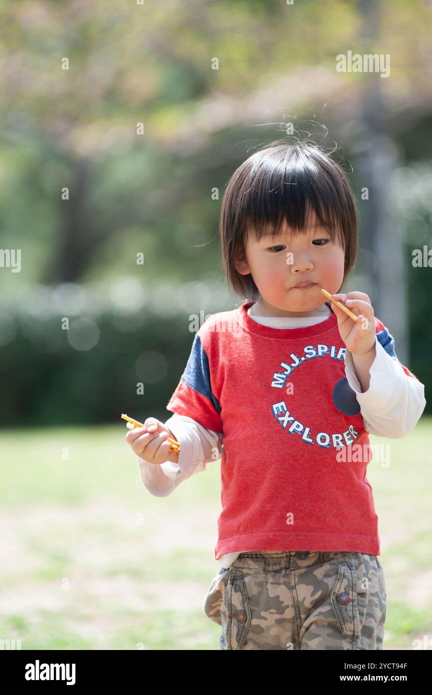 Boy eating snack Stock Photo - Alamy