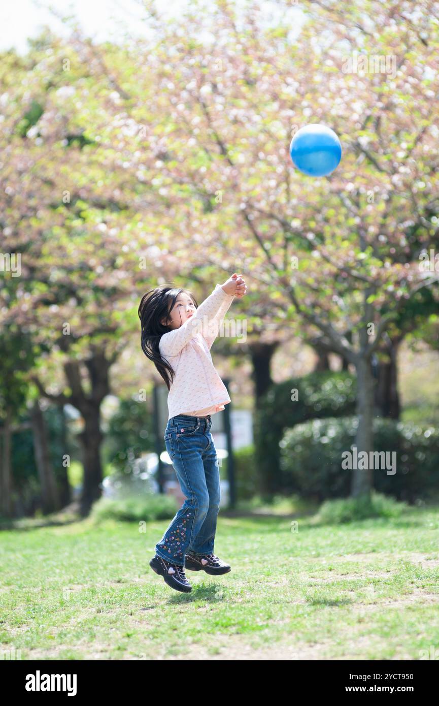 Girls playing ball Stock Photo - Alamy
