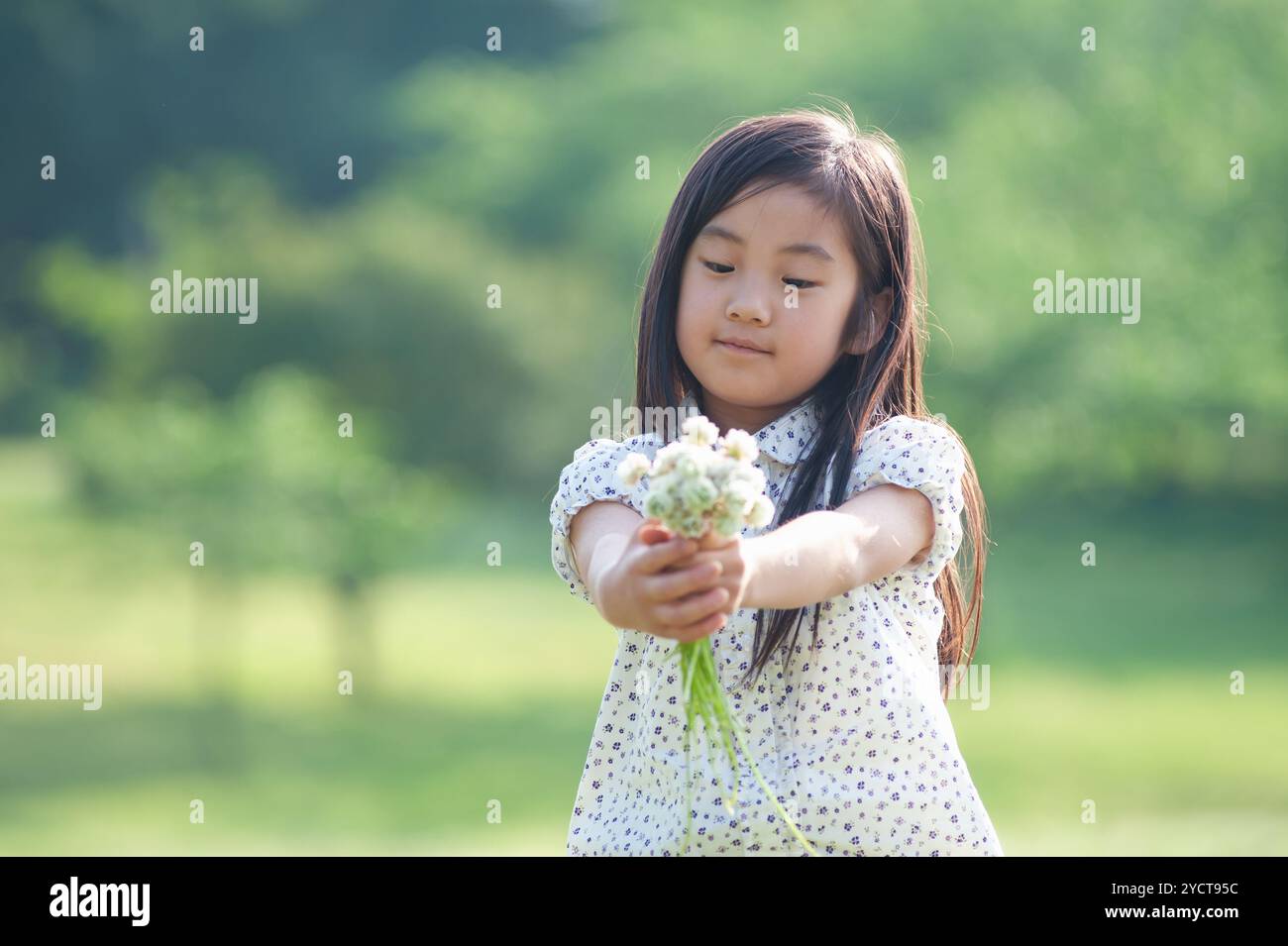 Child offering gift hi-res stock photography and images - Alamy