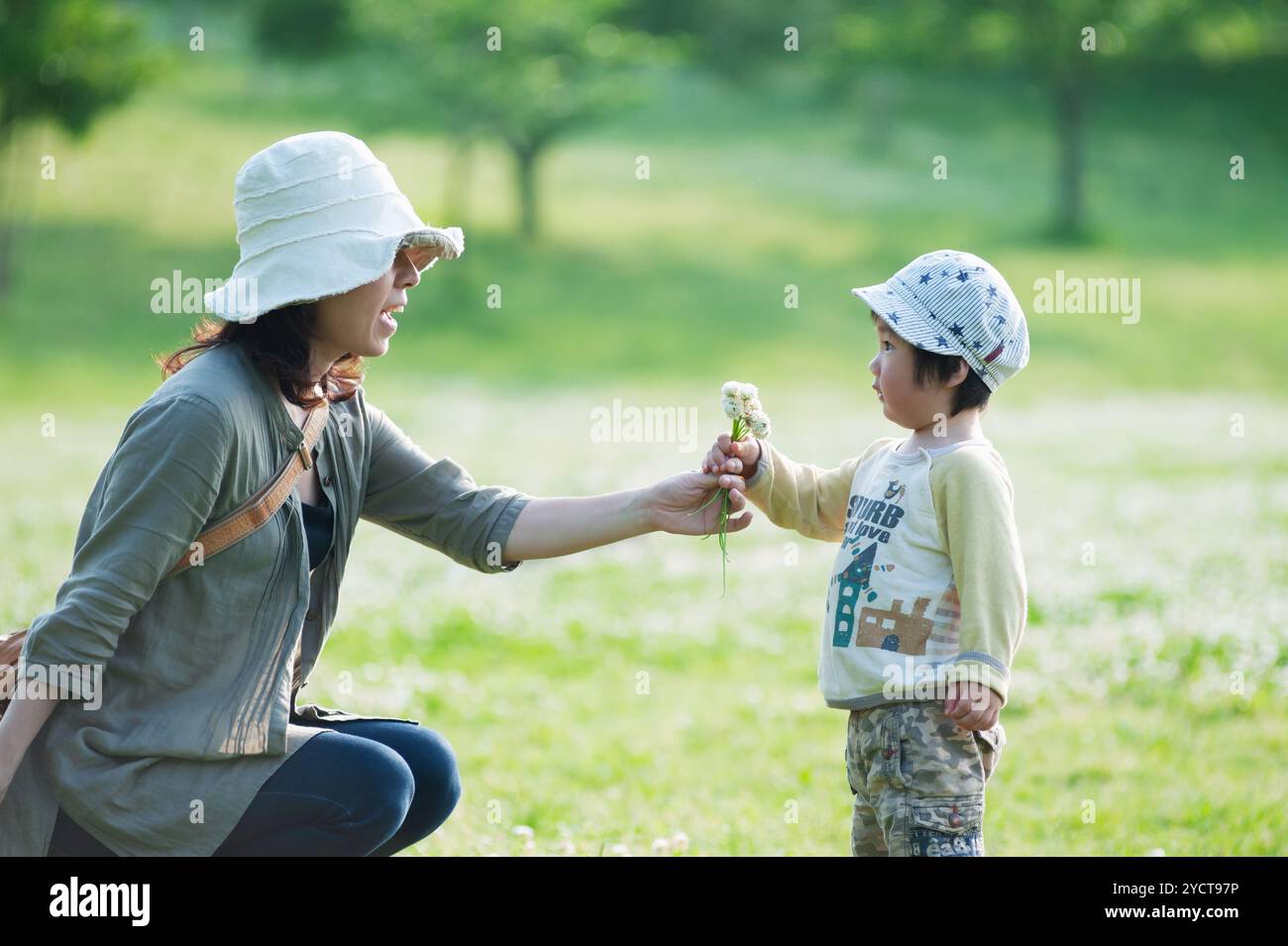 Child offering gift hi-res stock photography and images - Alamy