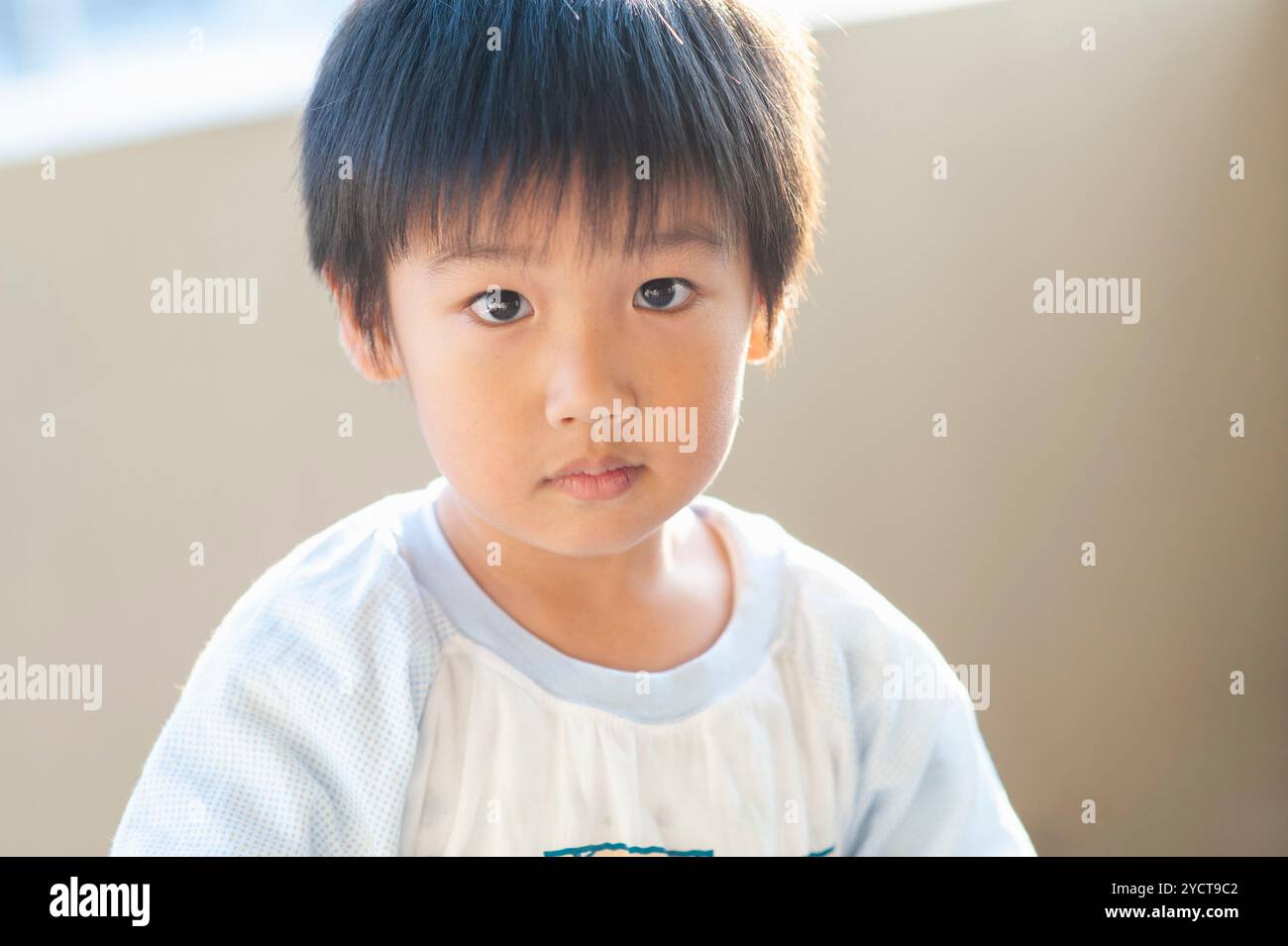 Boy looking at camera Stock Photo - Alamy