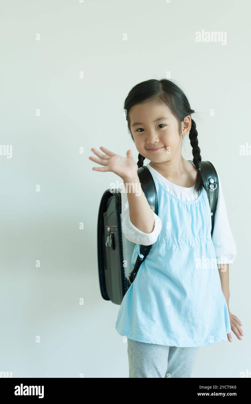 School girl waving hi-res stock photography and images - Alamy