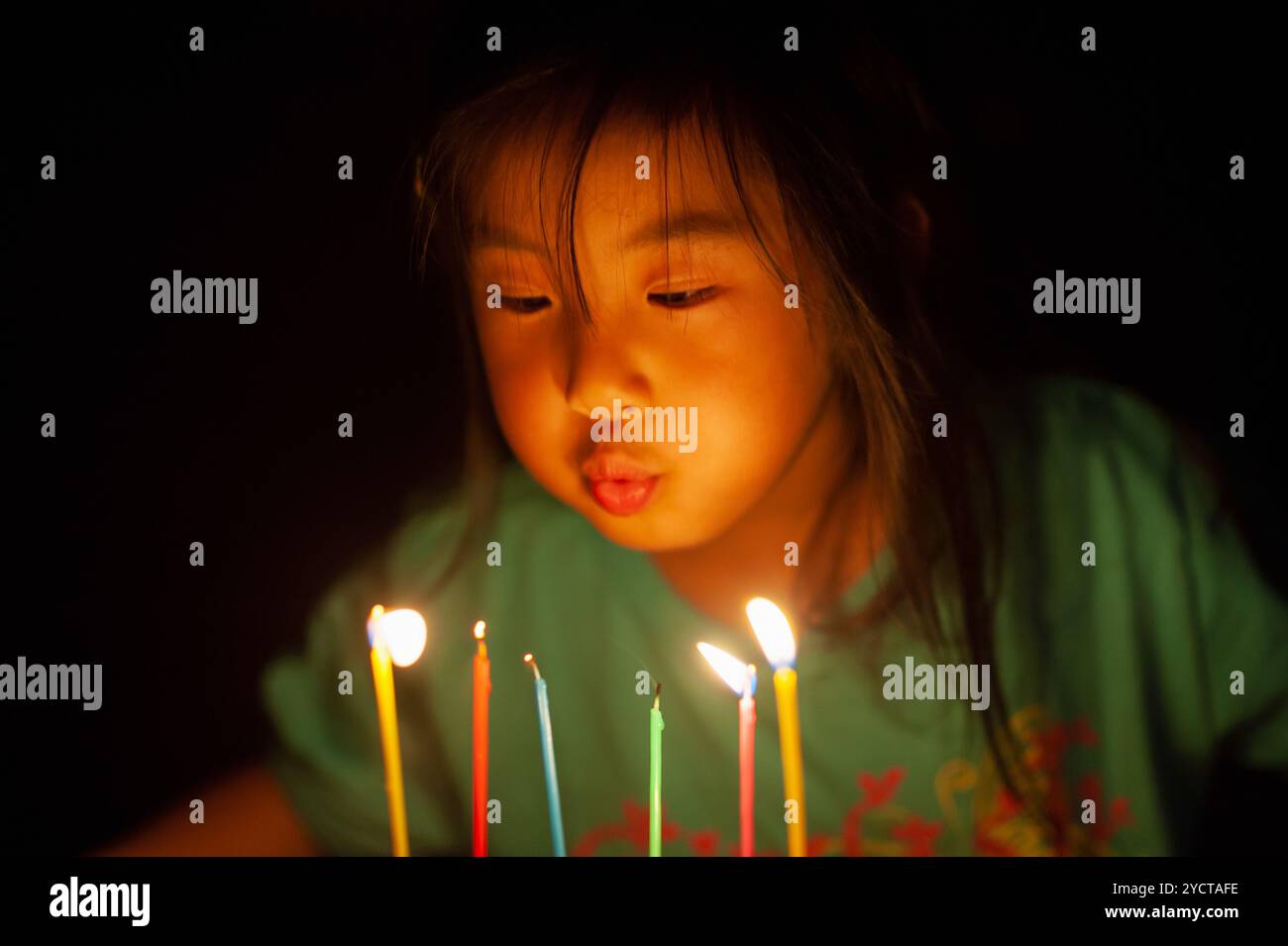 Girl blowing out fire hi-res stock photography and images - Alamy