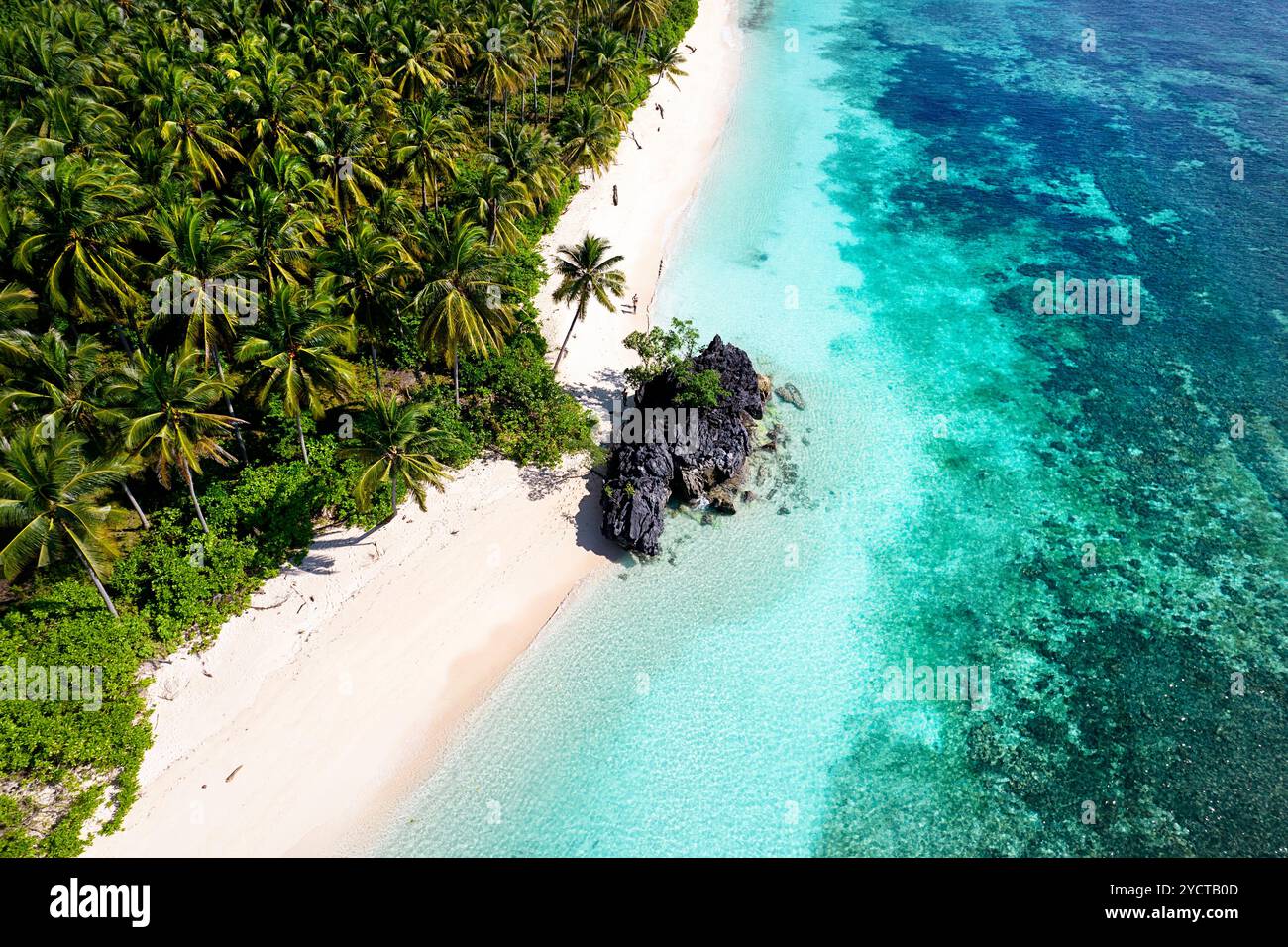 A beautiful empty tropical beach with white sand, crystal clear water ...
