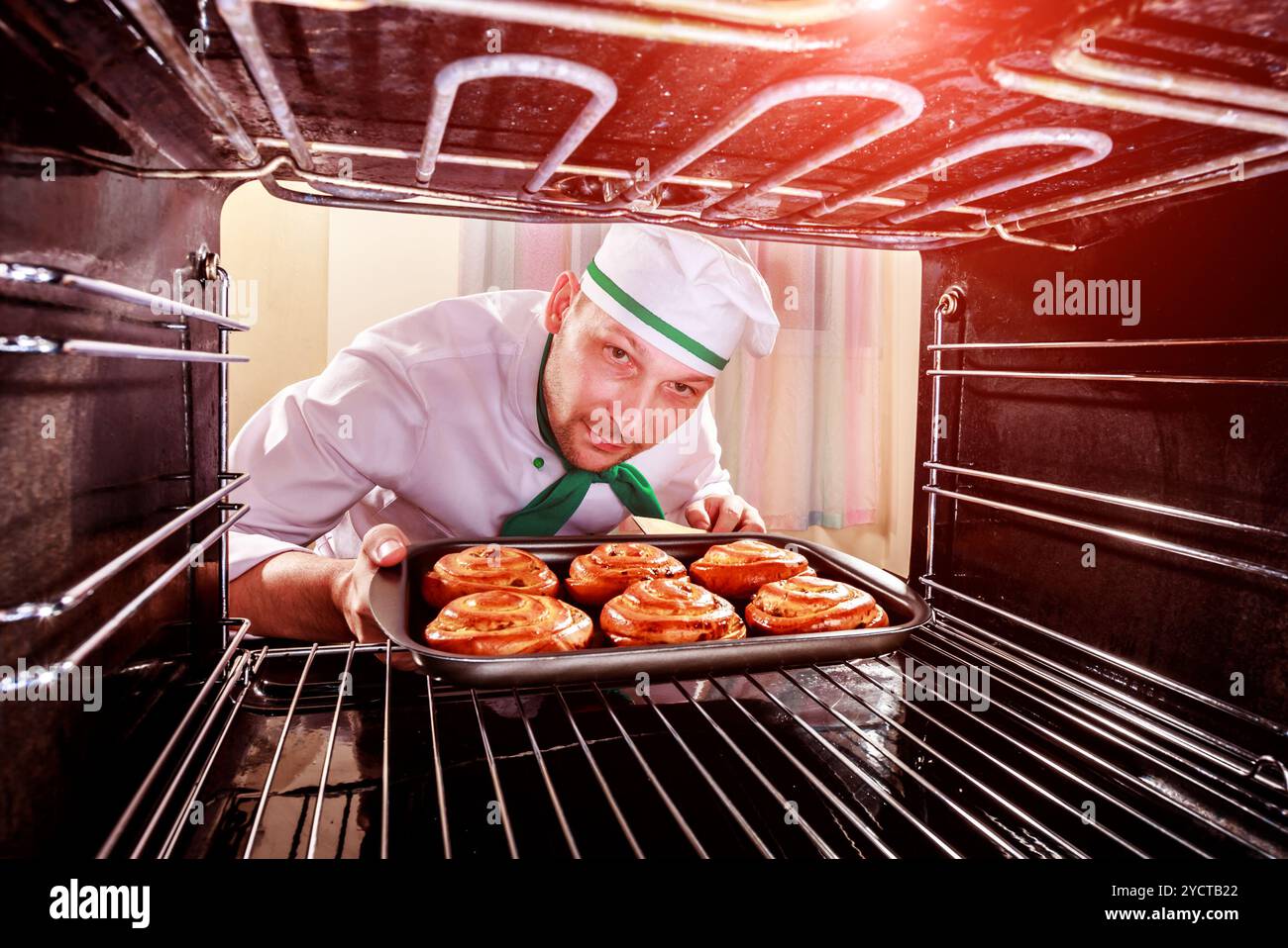 Chef cooking in the oven Stock Photo - Alamy