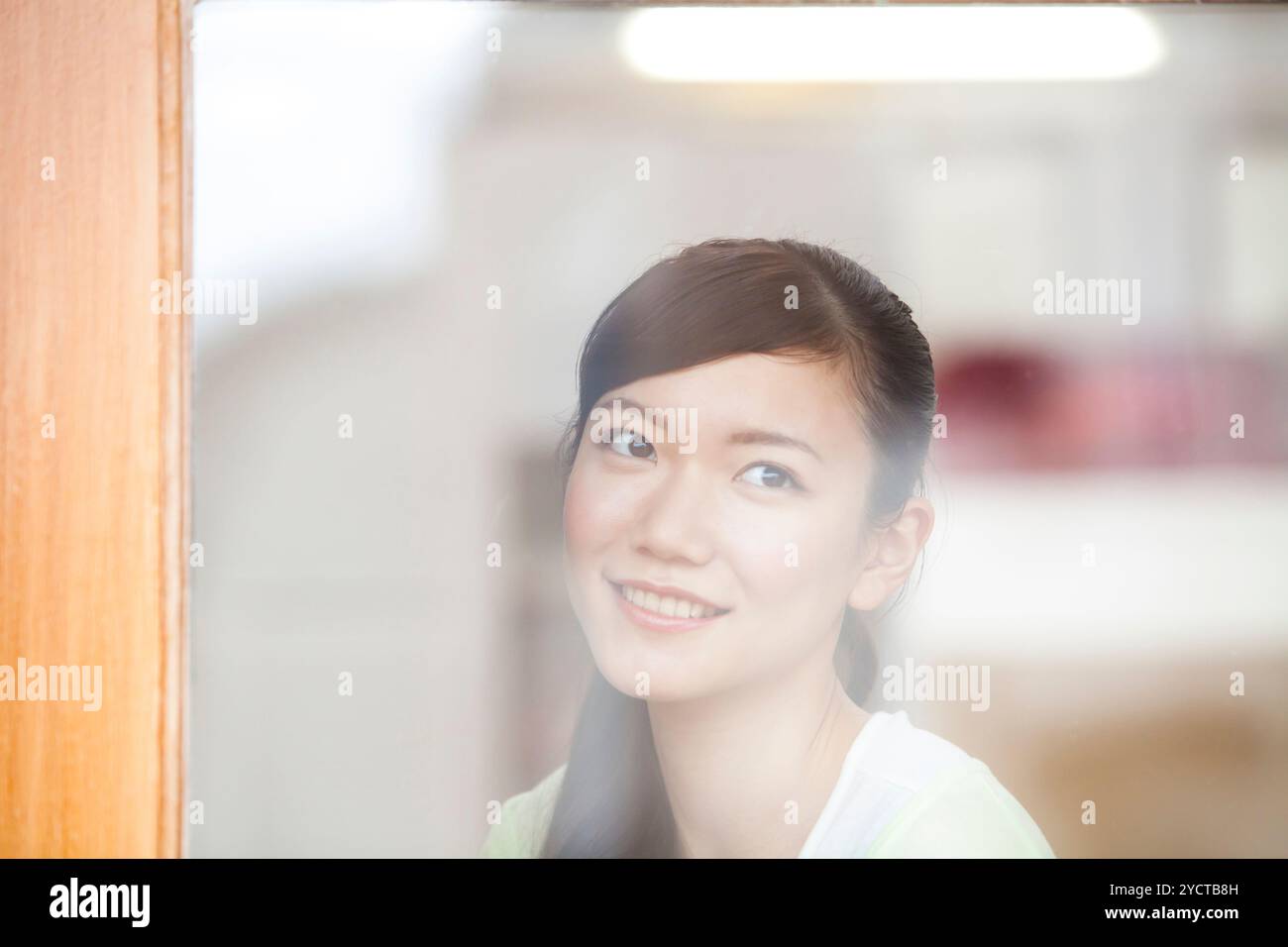Person looking out window tokyo hi-res stock photography and images - Alamy