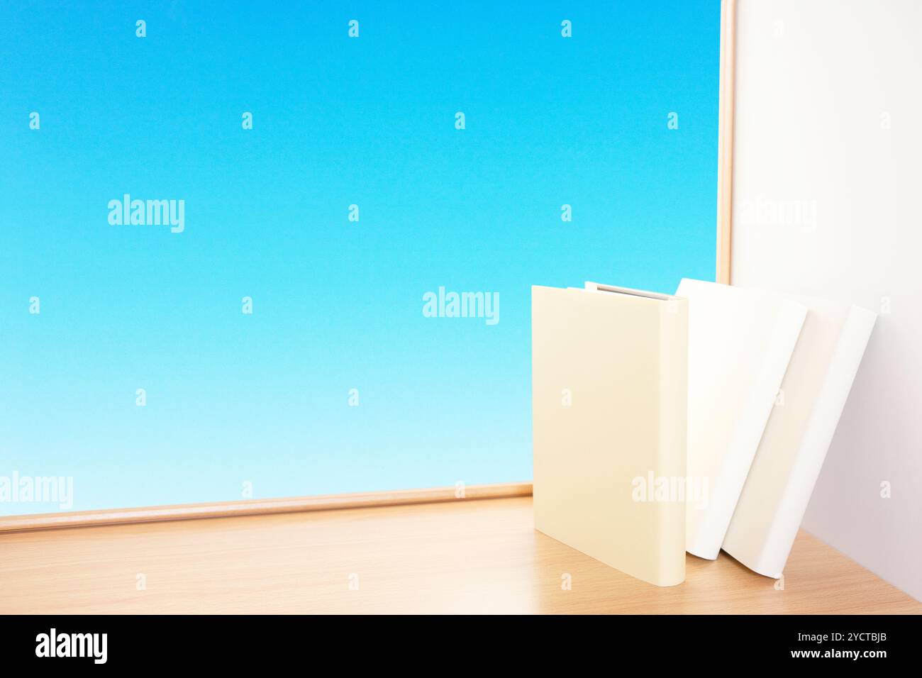 Books placed by the window Stock Photo - Alamy
