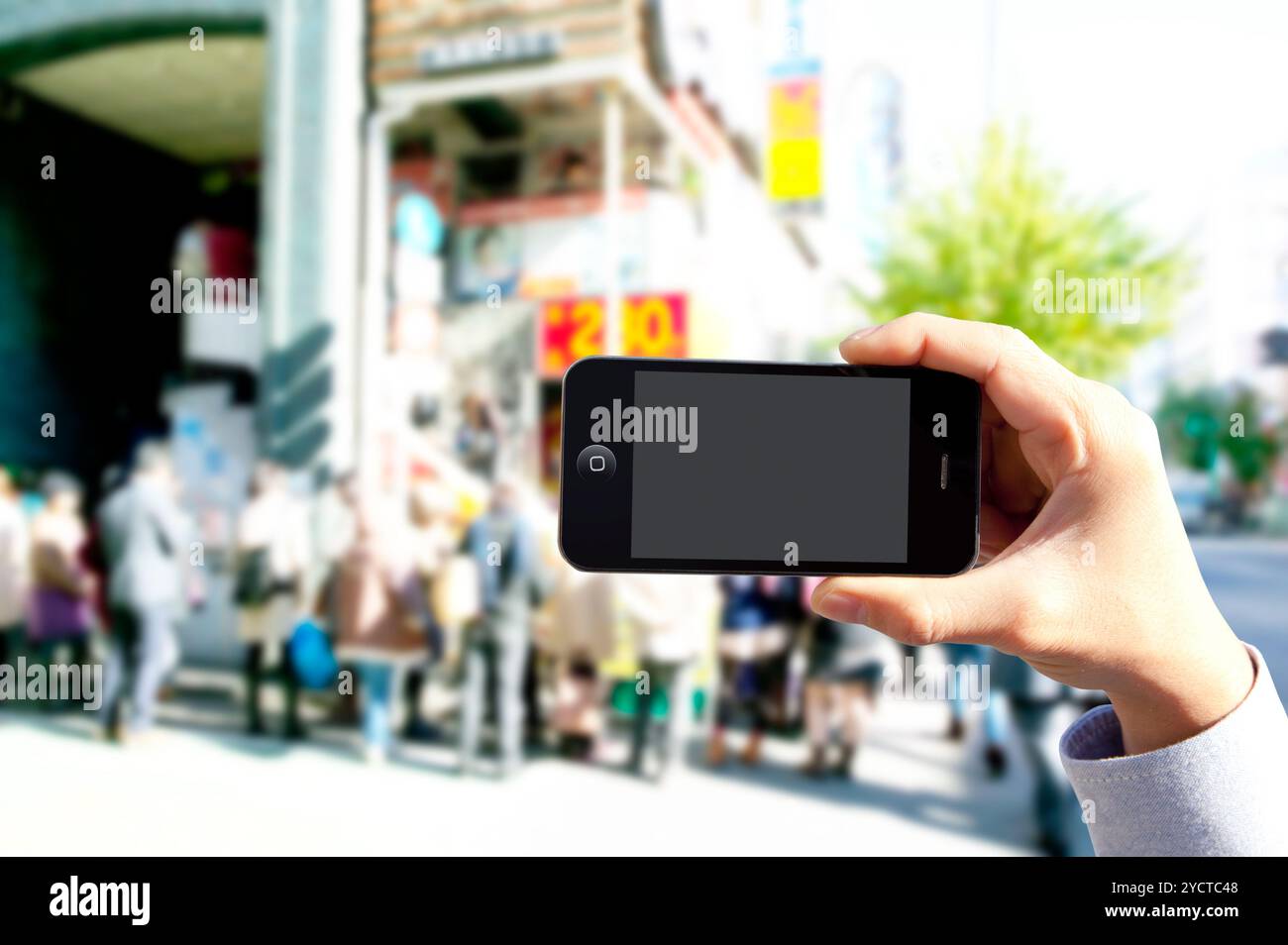 Smartphone held by man Stock Photo - Alamy