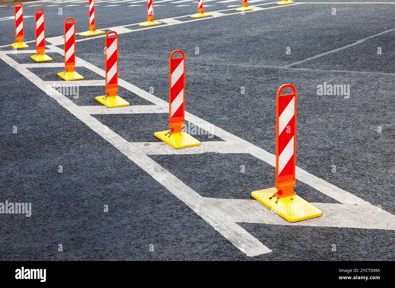 Traffic safety. Traffic markings on a gray asphalt. Red and white ...