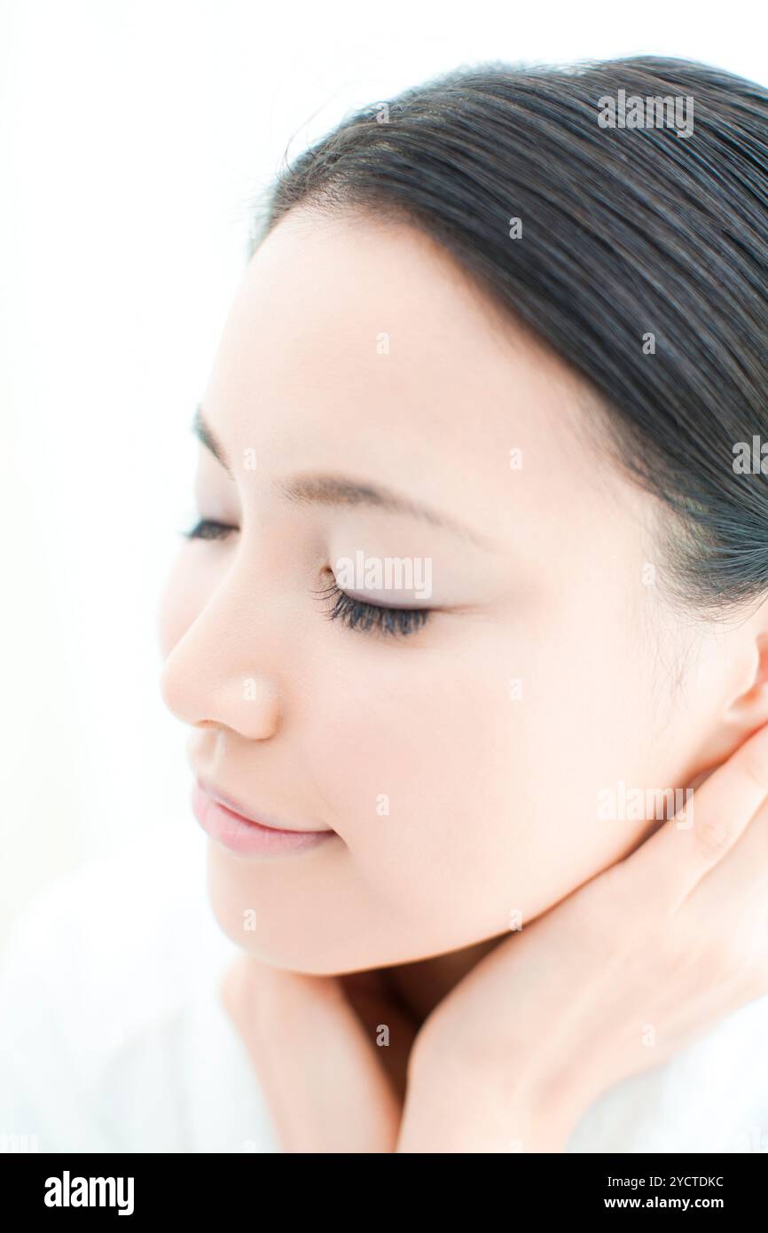 Woman touching chin one hi-res stock photography and images - Alamy