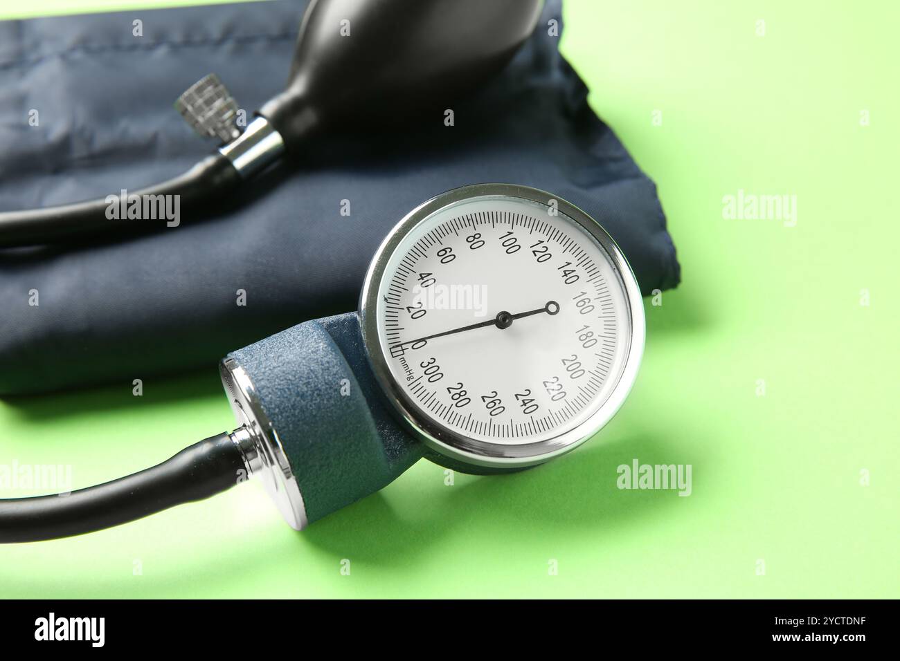 Blood pressure measuring device on green background, closeup Stock ...