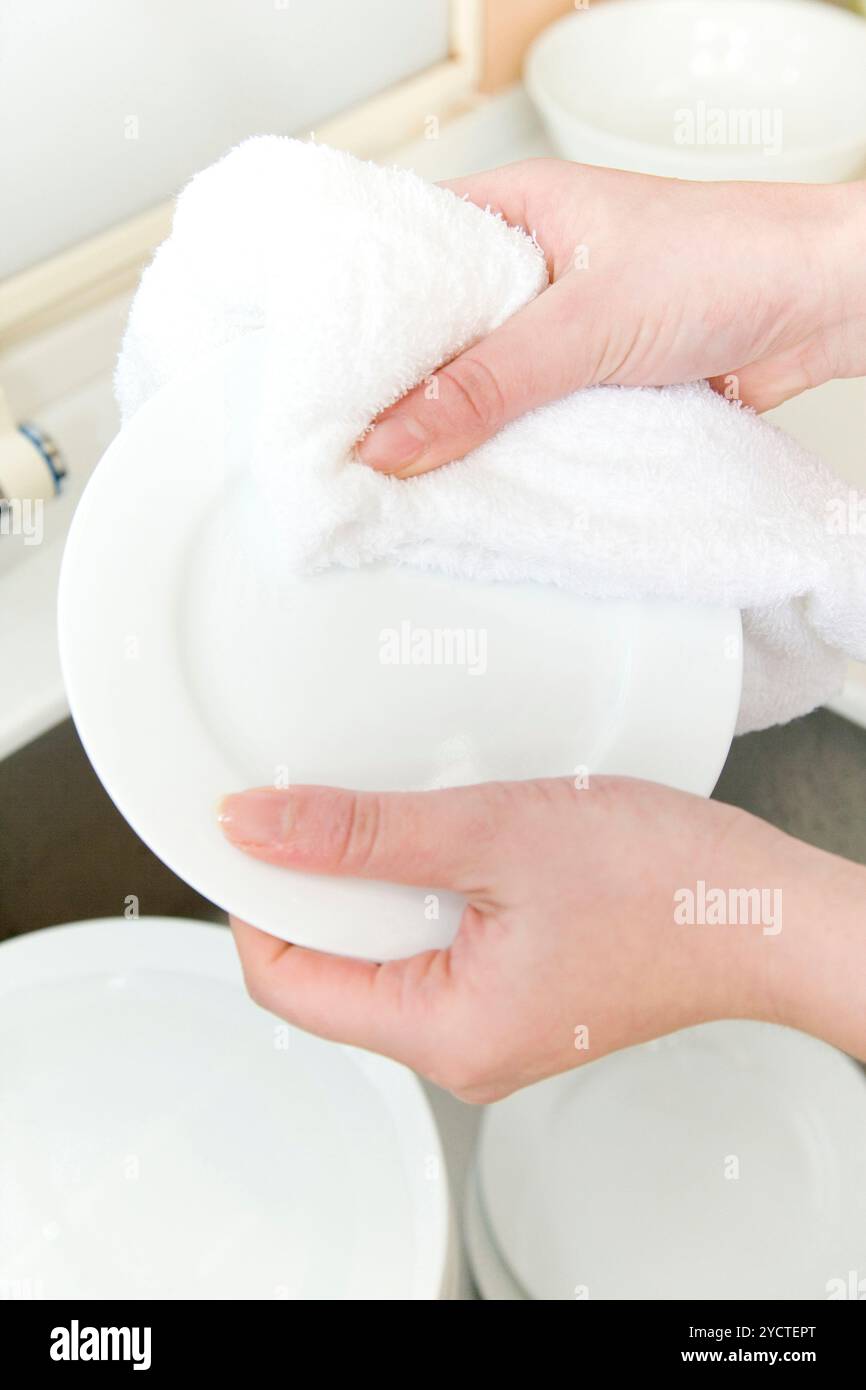 Woman wiping hand hi-res stock photography and images - Alamy