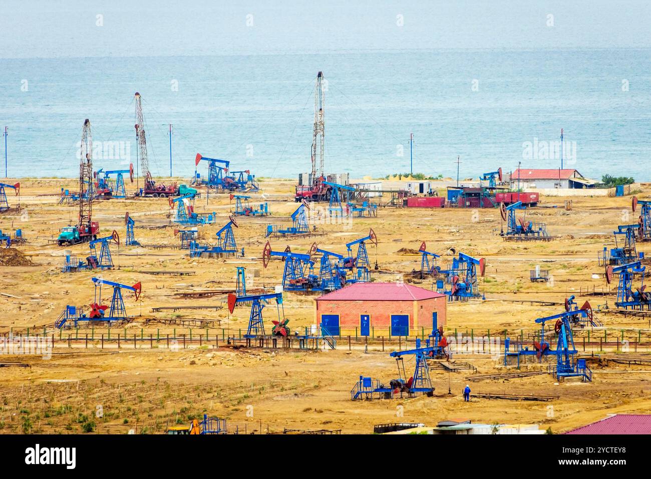 Oil pumps and rigs by the Caspian coast Stock Photo - Alamy