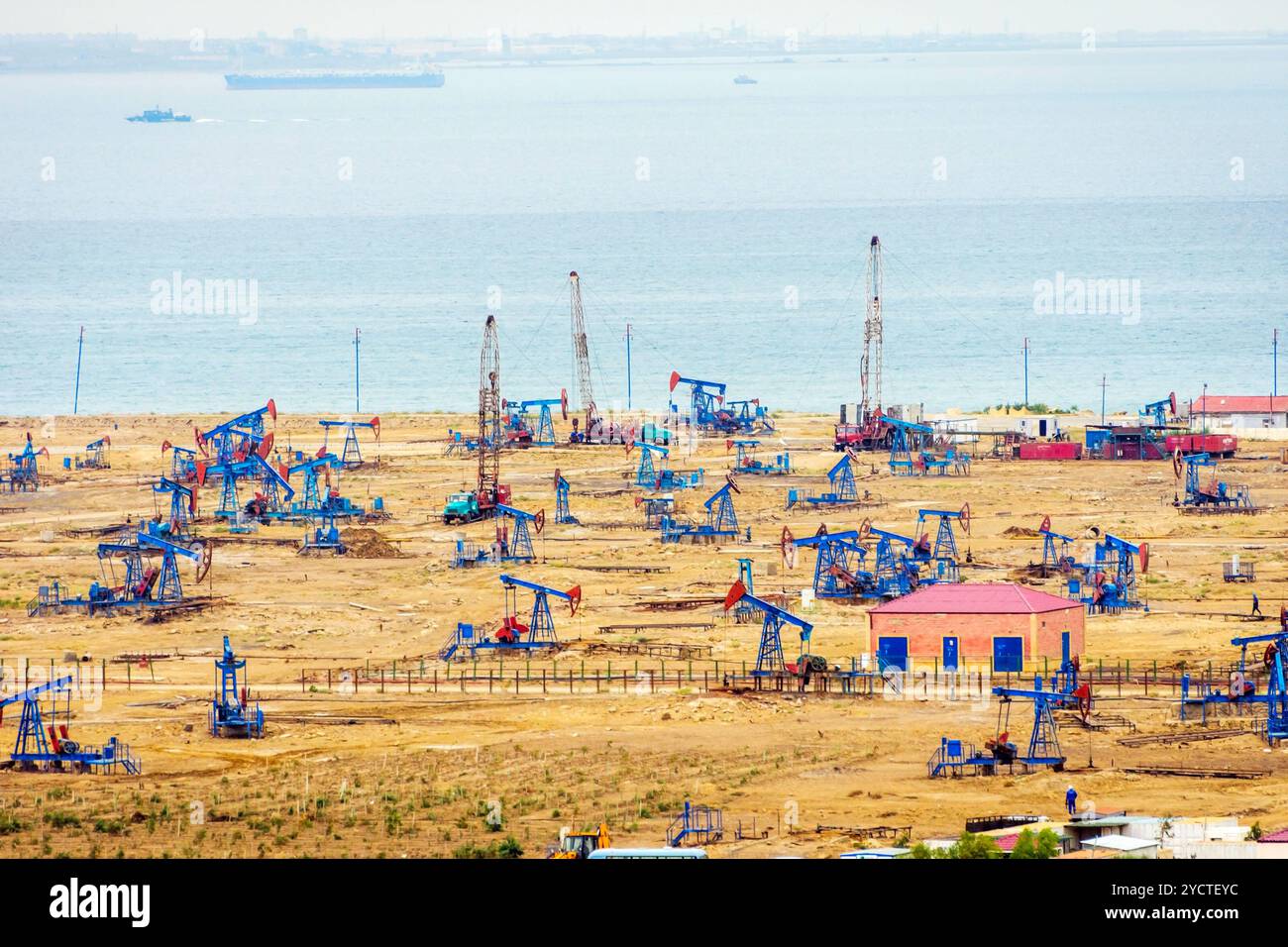 Oil pumps and rigs at the field by Caspian sea near Baku, Azerbaijan ...