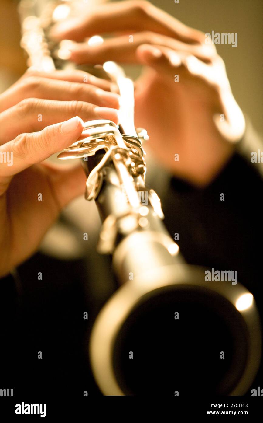 Hand playing clarinet Stock Photo - Alamy