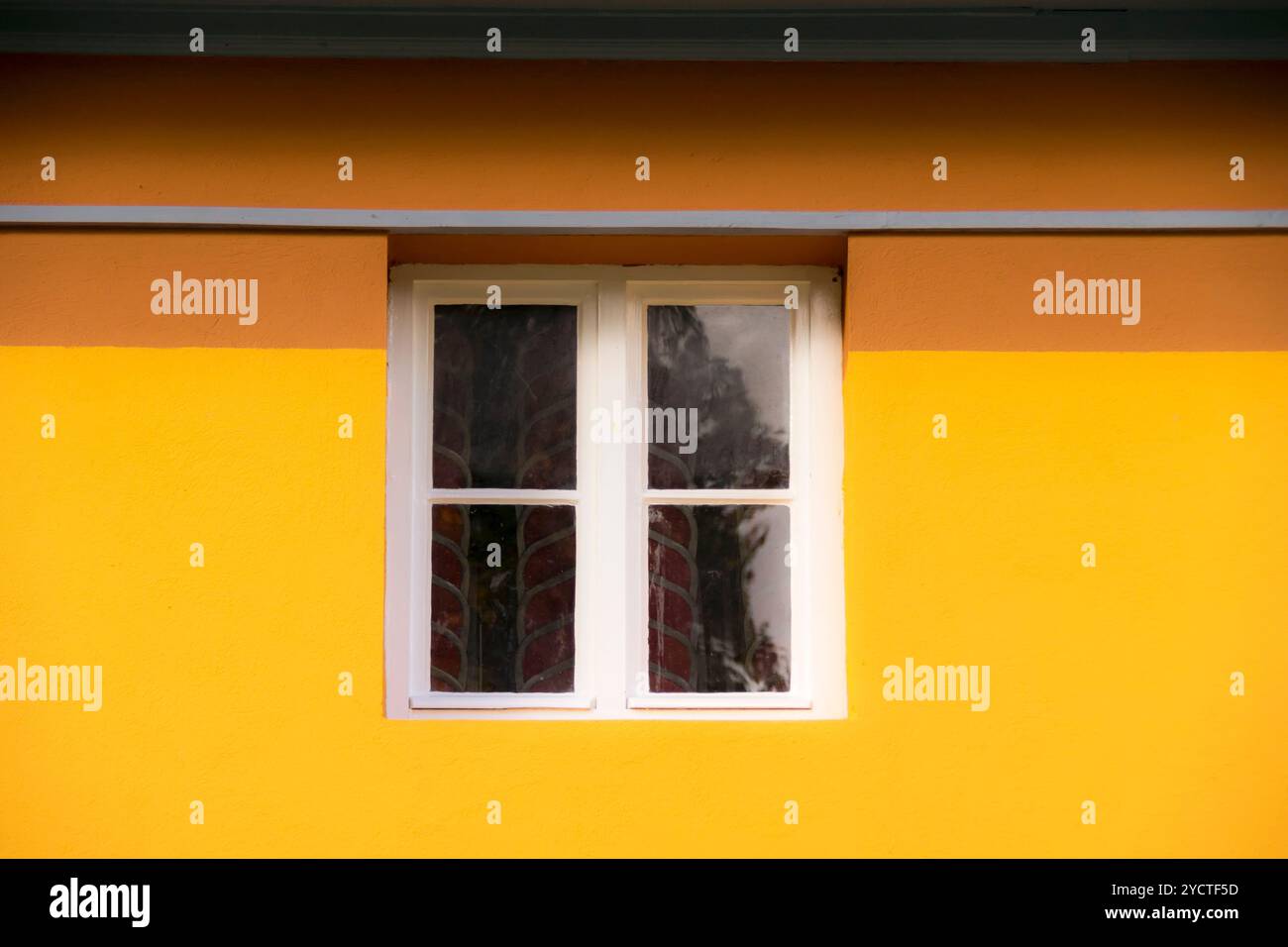 Window in the yellow house Stock Photo - Alamy