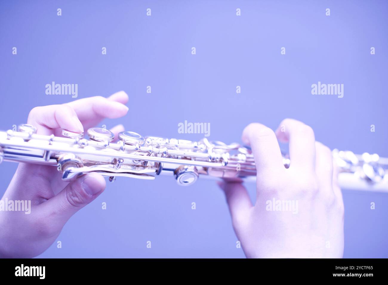 Hand playing flute Stock Photo - Alamy