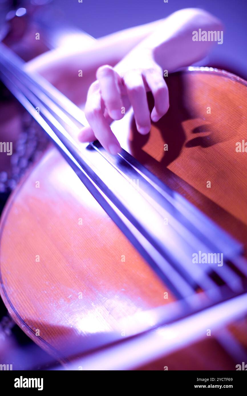 Hand playing cello Stock Photo - Alamy