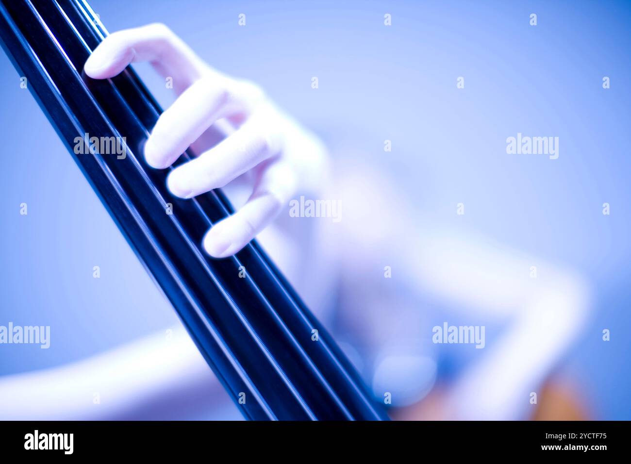 Hand playing the double bass Stock Photo - Alamy