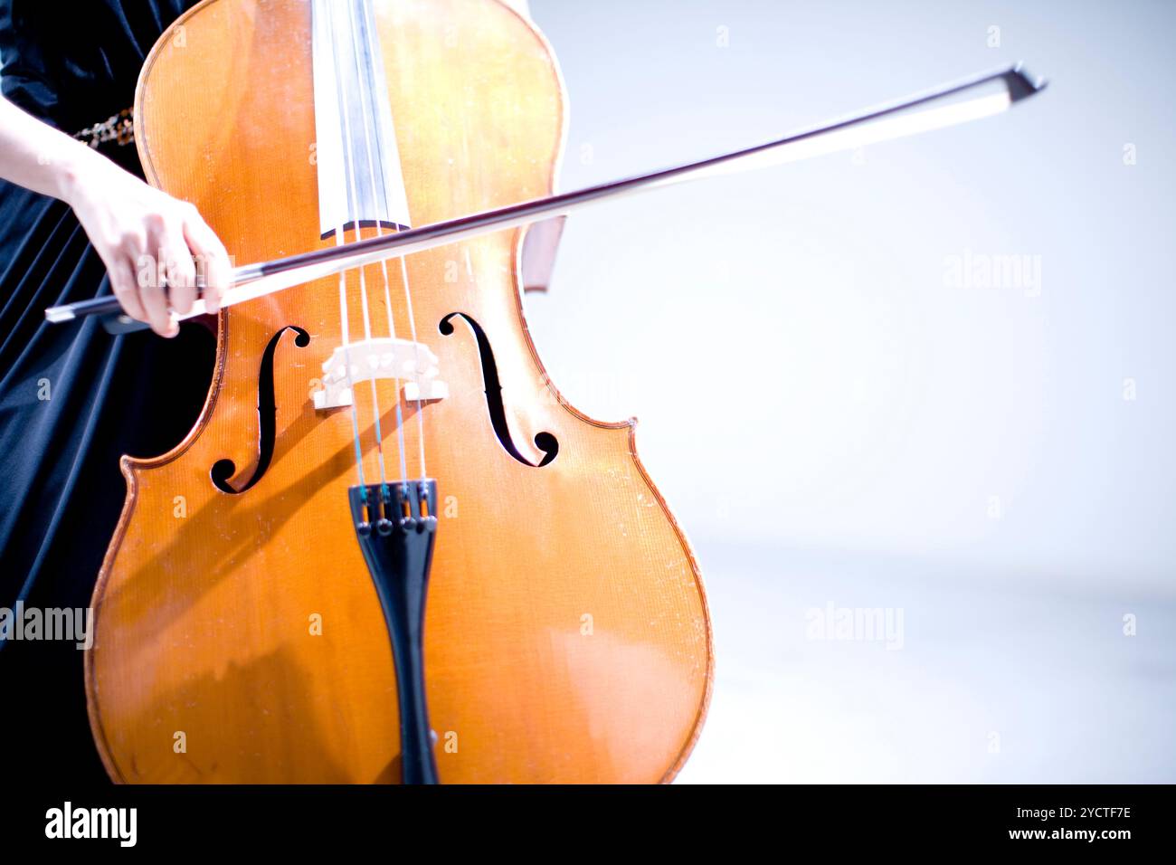 Hand playing cello Stock Photo - Alamy