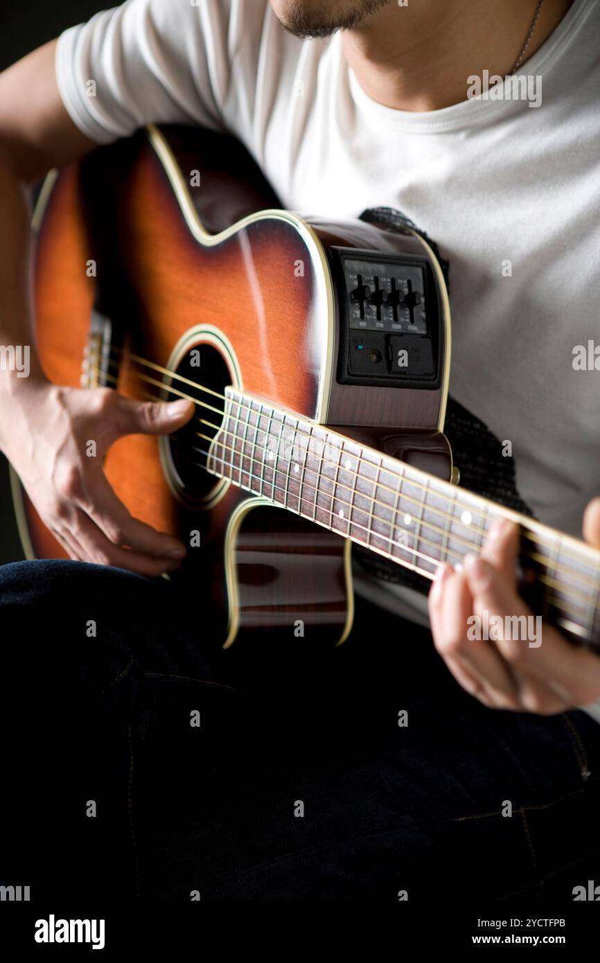 Person acoustic guitar acoustic guitar hi-res stock photography and ...